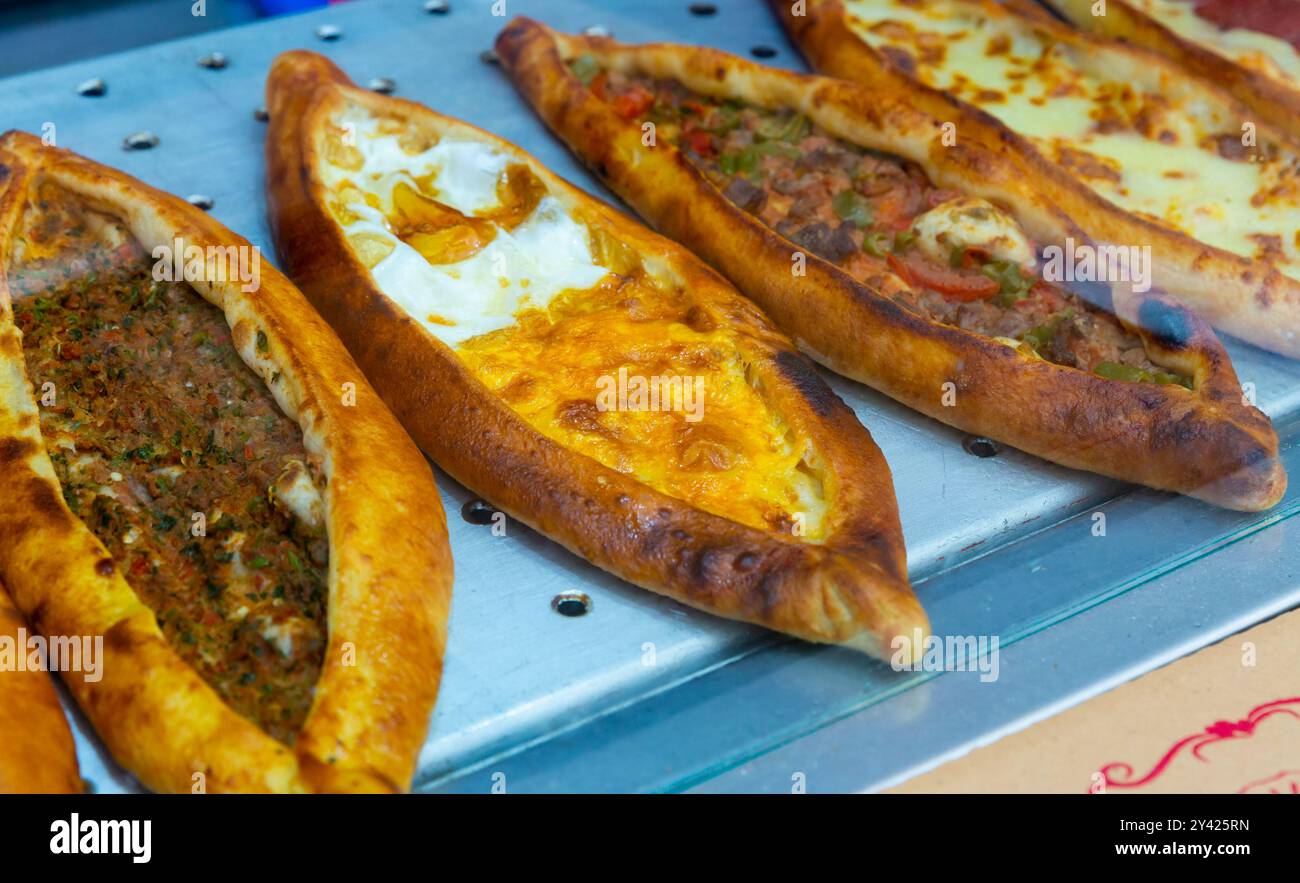 Traditional Turkish pide with various fillings on bakery showcase Stock ...