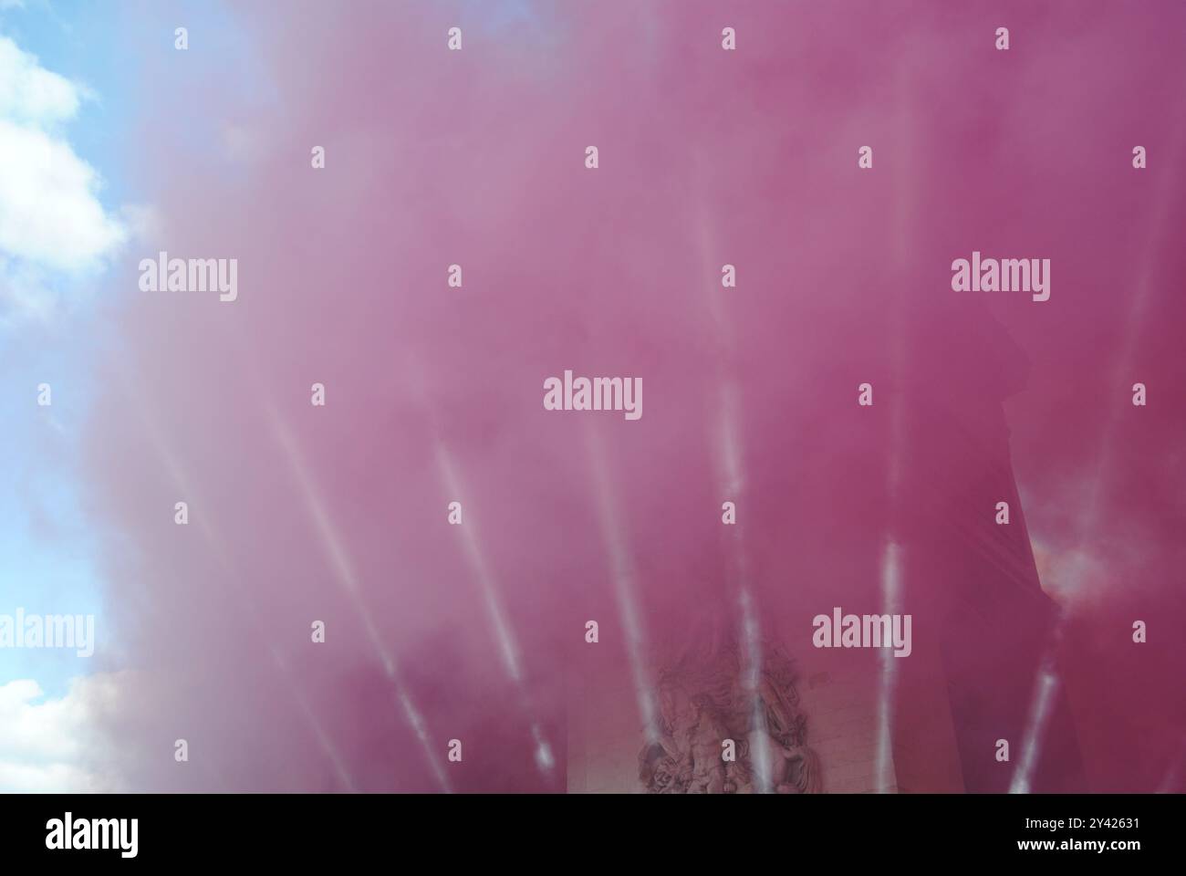Paris, France - September 14 2024: Red smoke erupts around the Arc de ...