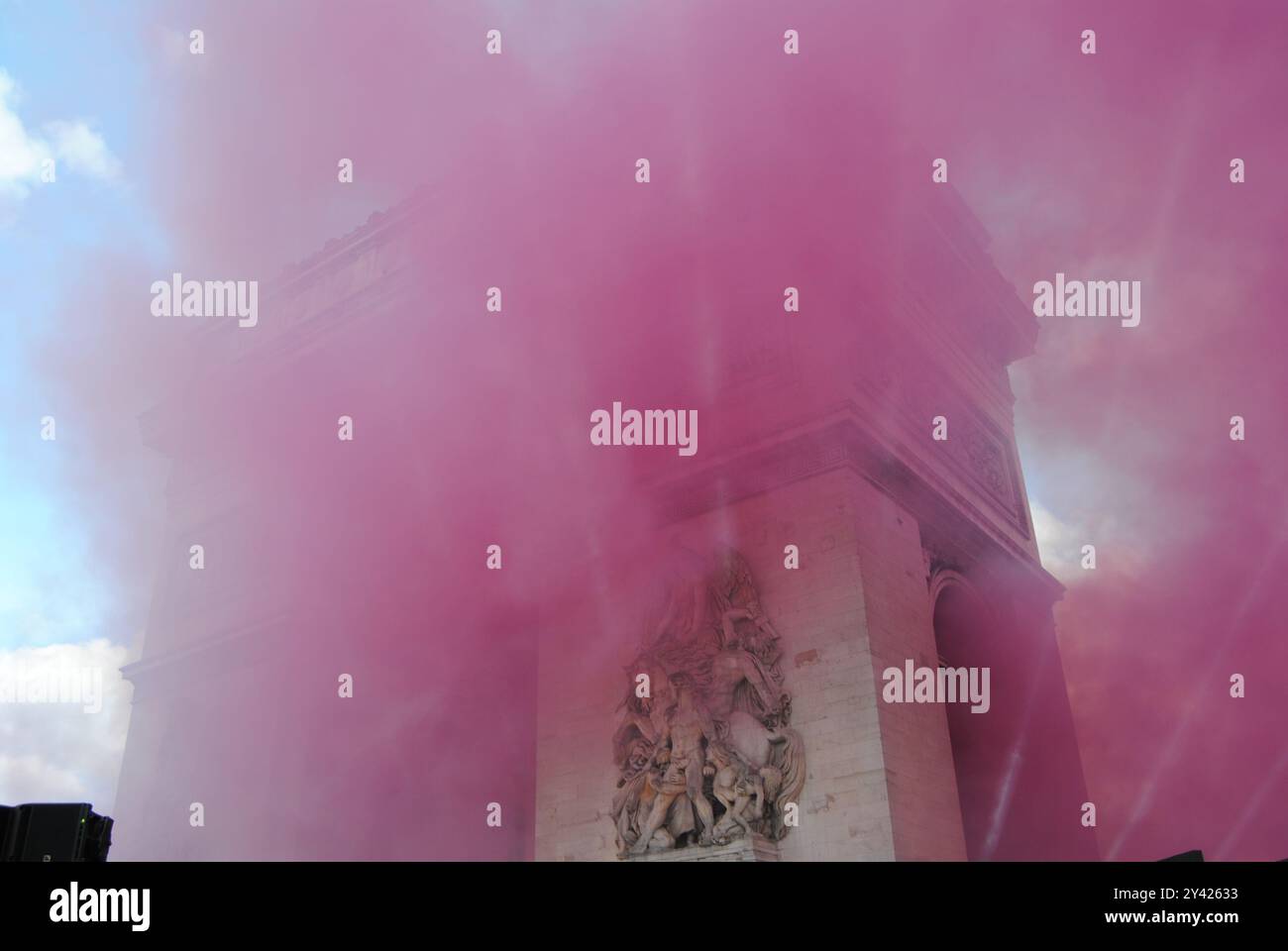 Paris, France - September 14 2024: Red smoke erupts around the Arc de ...