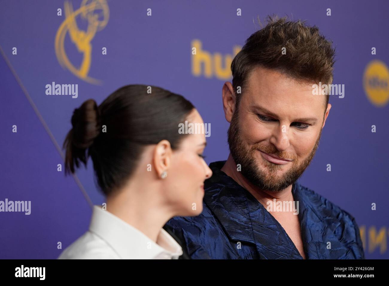Emily Hampshire, left, and Bobby Berk arrive at the 76th Primetime Emmy ...