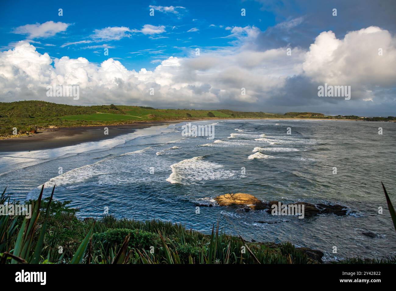Rugged beach and costal scene on the cliffside walk by the ocean Stock ...
