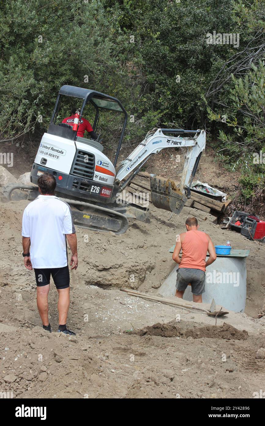 bob cat excavator at a construction site,heavy machinery for earthworks ...