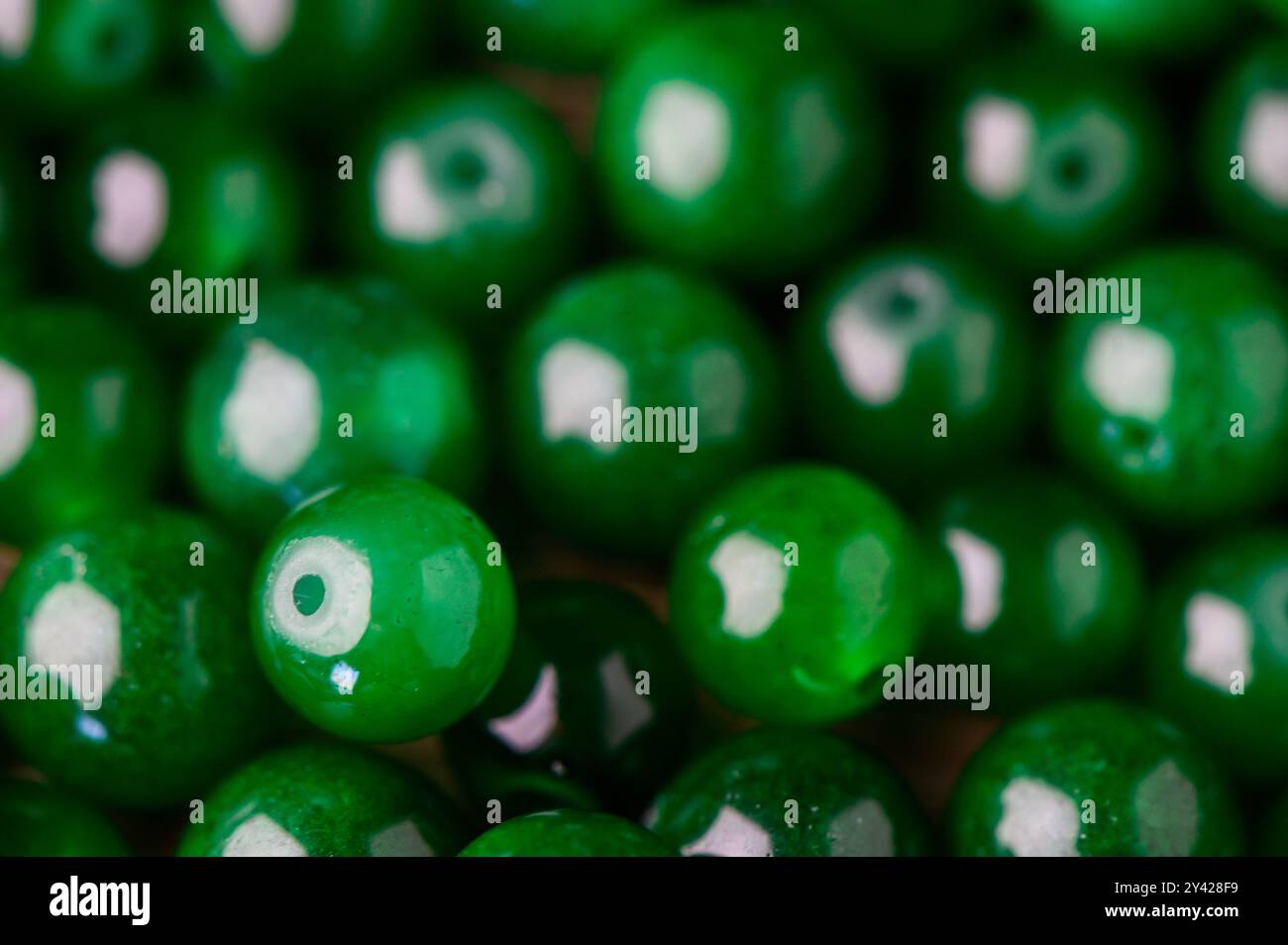 green balls of real stone for making magic amulets as a background 1 ...