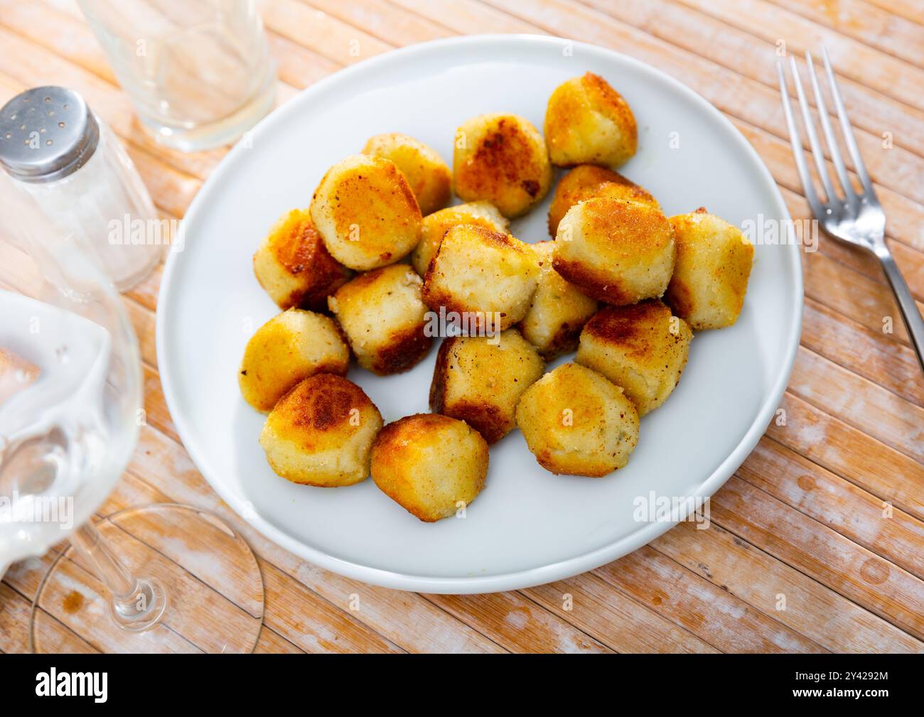 Classic French breaded and deep-fried cheese croquettes on plate Stock ...