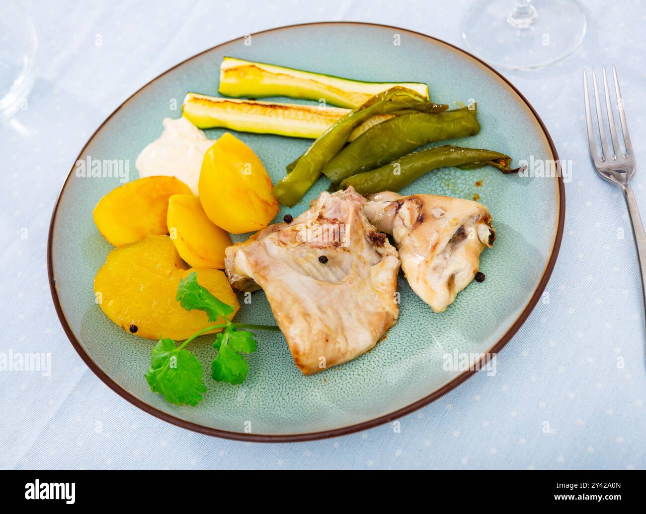 Roasted rabbit served with vegetable garnish Stock Photo - Alamy
