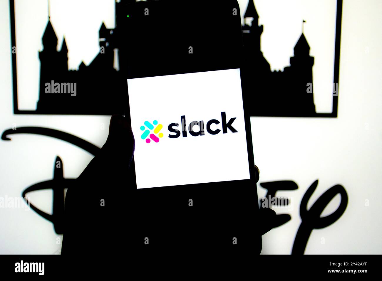 In this photo illustration, a Slack logo seen displayed on a smartphone ...