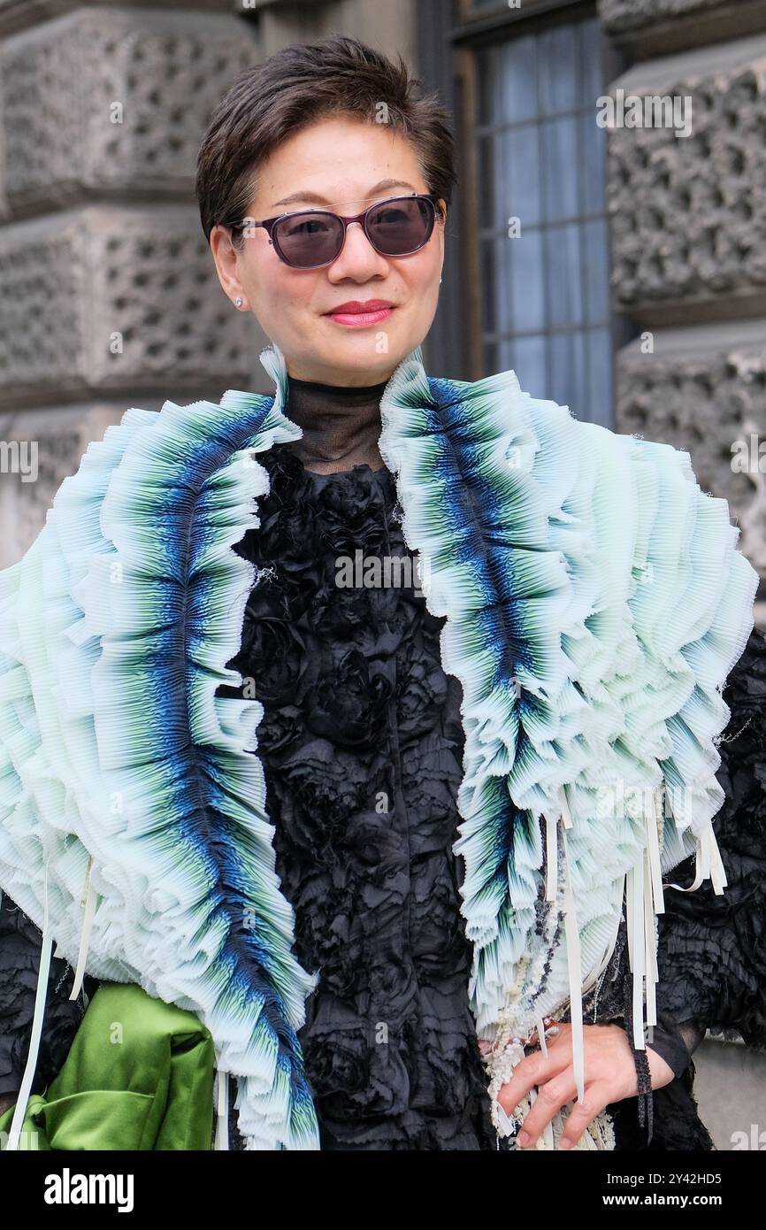A guest poses for photos after the Simone Rocha SS25 show during London ...