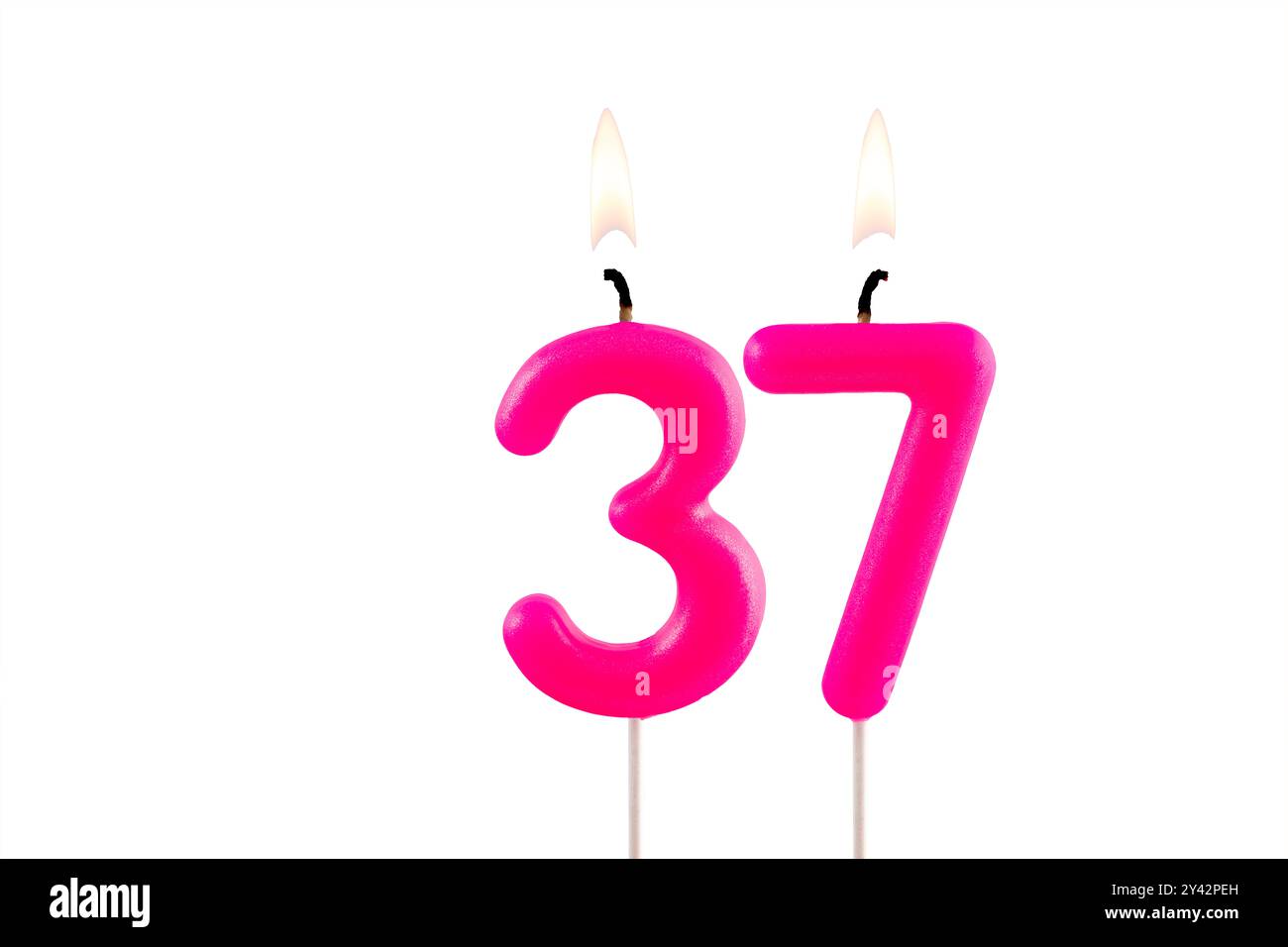 Pink number 37 birthday candle on white background Stock Photo - Alamy