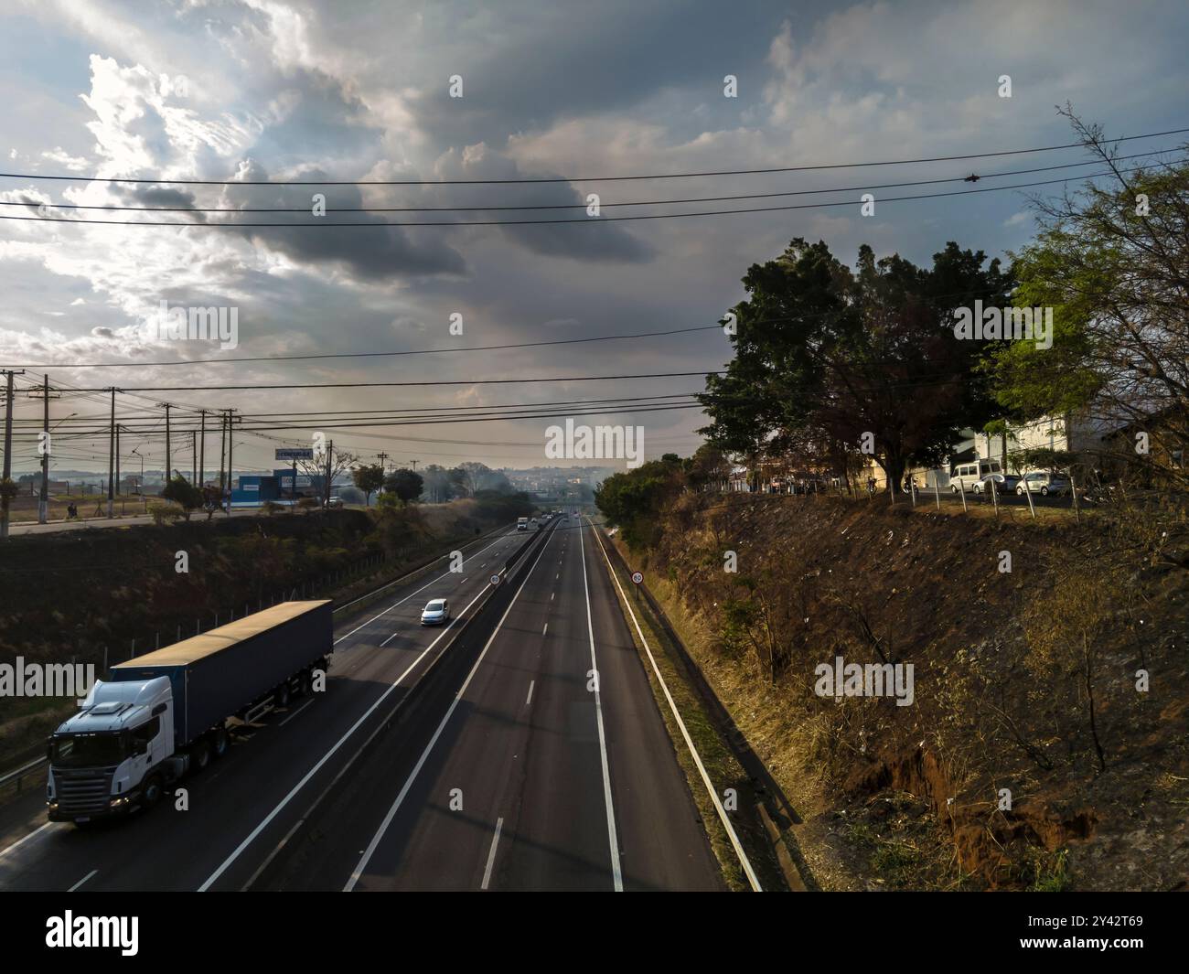 Marilia, SP, Brazil, August 16, 2024. Dry bush catches fire next to a ...