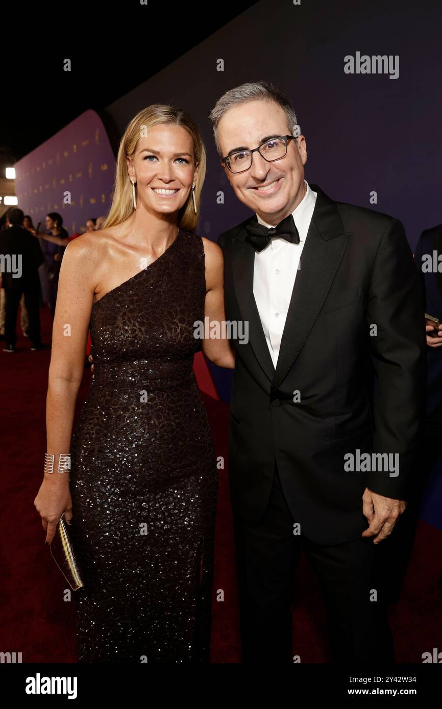Kate Norley and John Oliver walk the Red Carpet at the 76th Emmy Awards ...