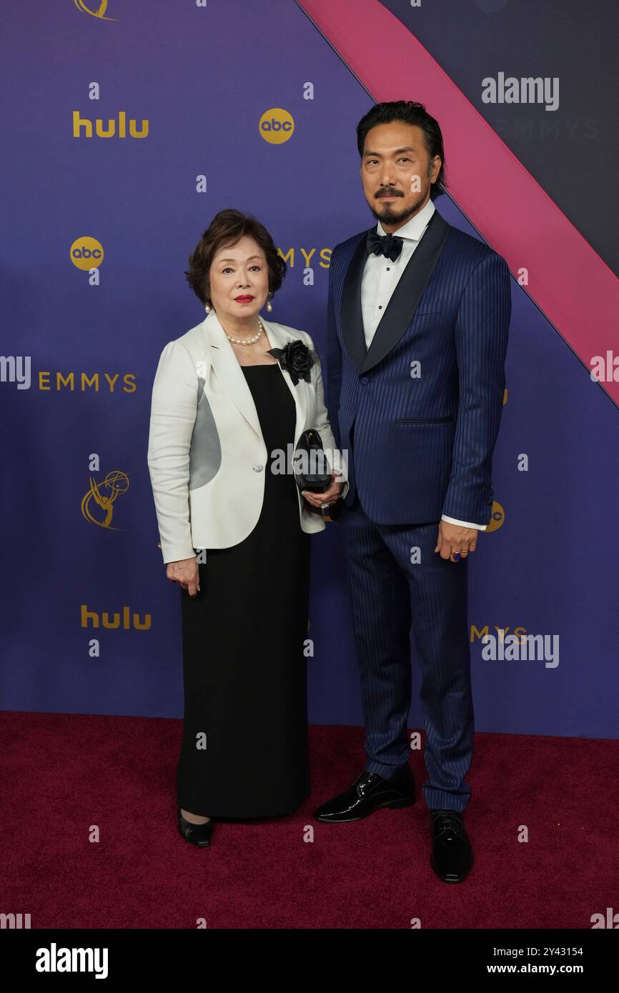 Yoshiko Sakuma and Takehiro Hira pose for a Red Carpet portrait at the ...