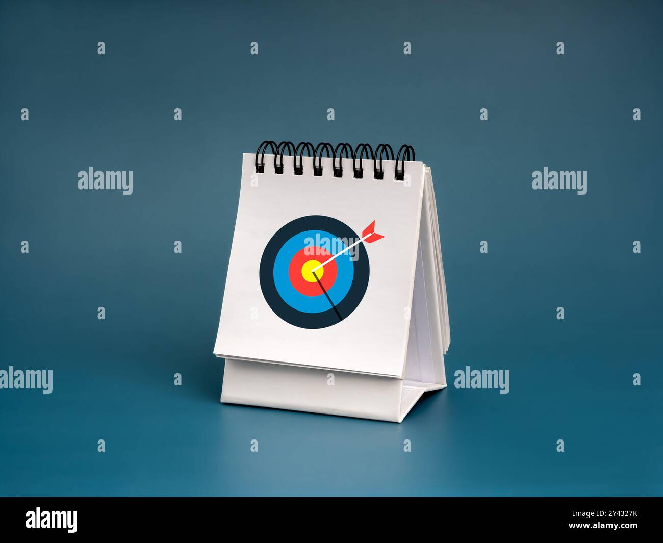 Modern colorful target dart bullseye icon on white desk calendar cover ...