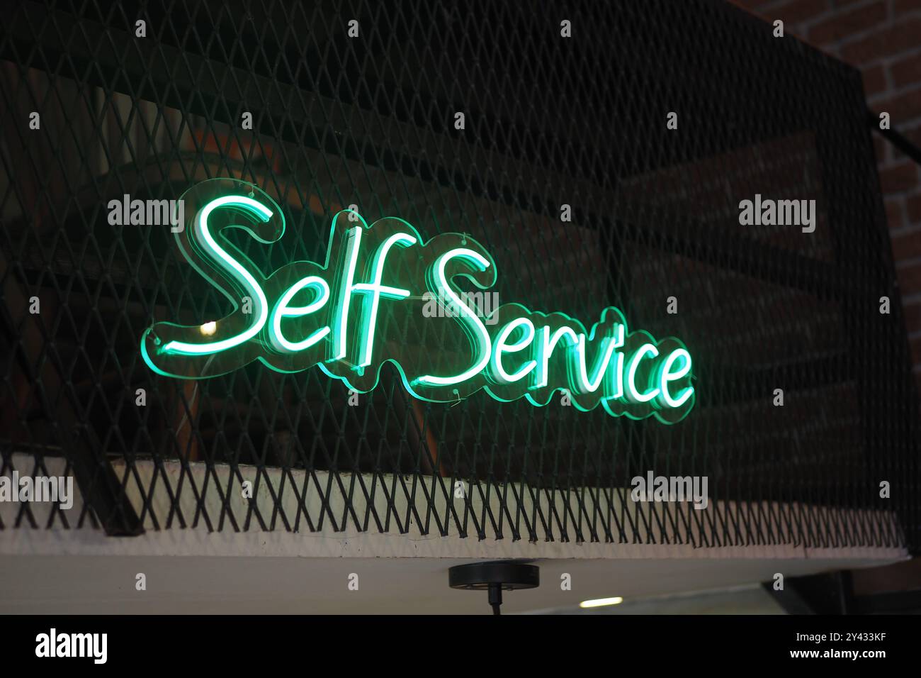 The Self Service Sign glows with vibrant Green Neon Light, boosting ...