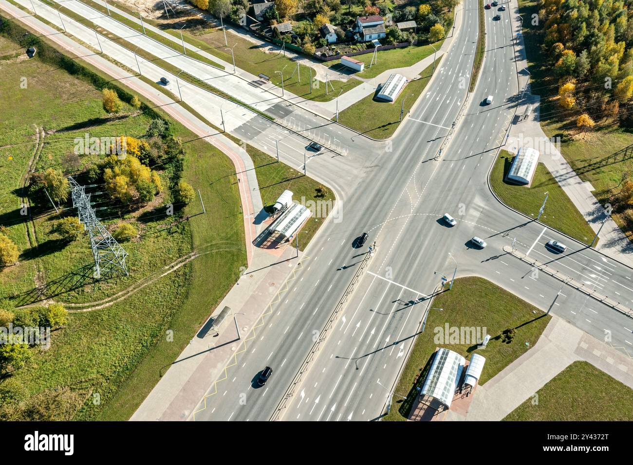 overhead view of road intersection in suburban residential area. drone ...