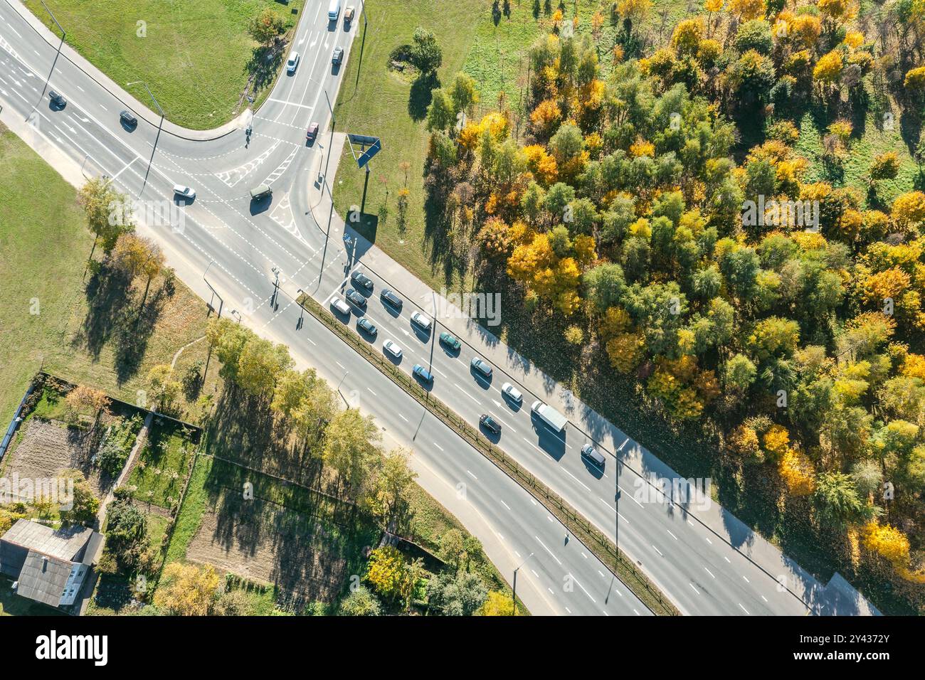 aerial view of suburban highway in autumn sunny day. viewpoint from ...