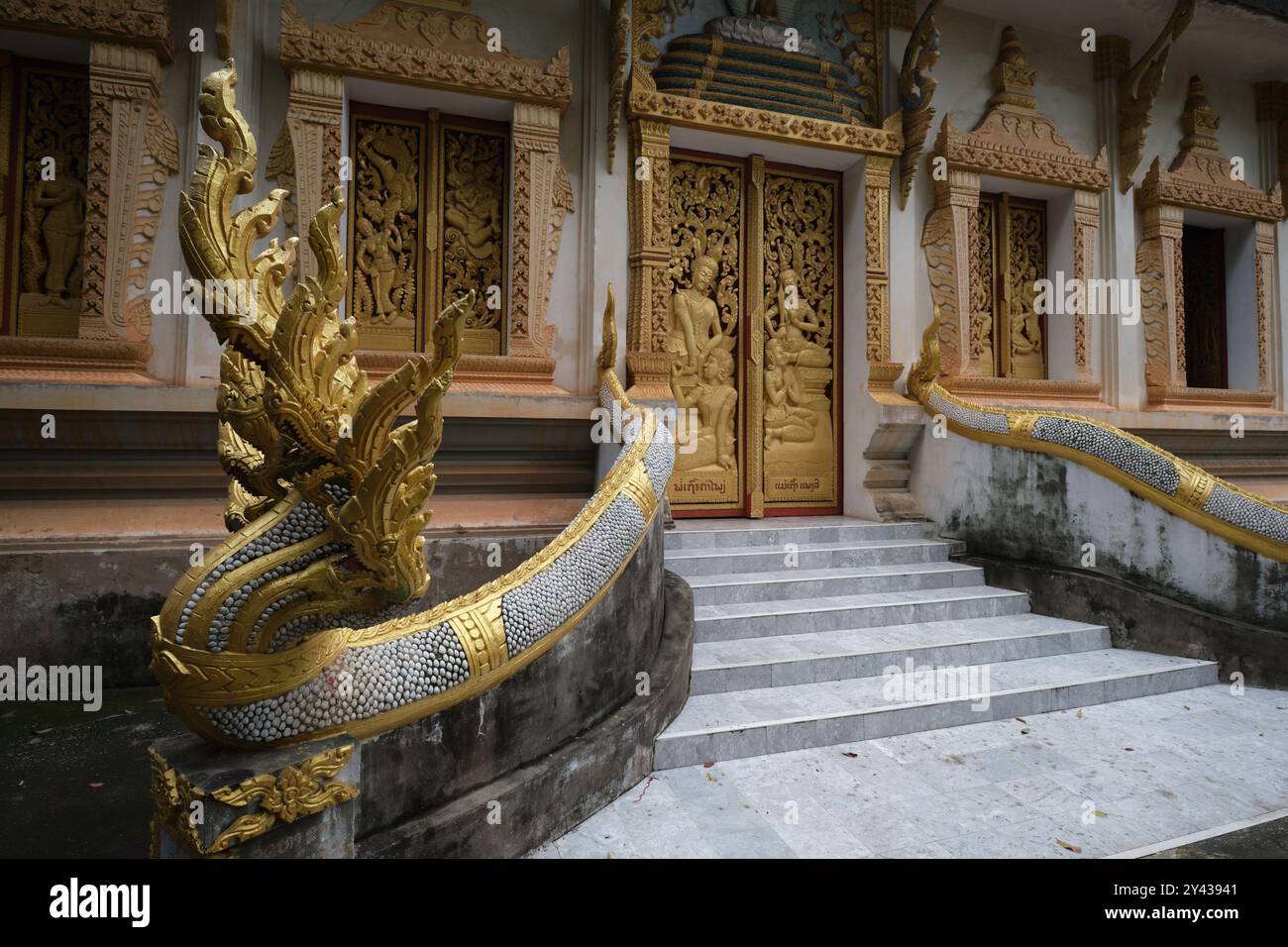 Detail of golden dragon railing on steps at Wat Haysoke in Vientiane ...