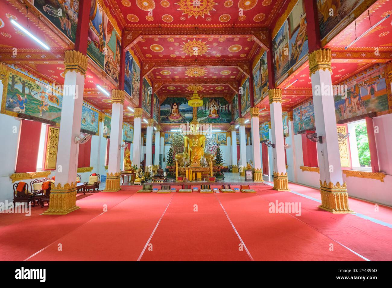 A rich, fancy, gold Buddha statue at the altar of Wat Haysoke in ...
