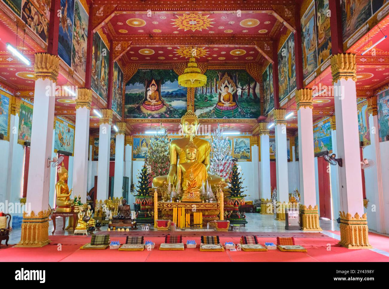 A rich, fancy, gold Buddha statue at the altar of Wat Haysoke in ...