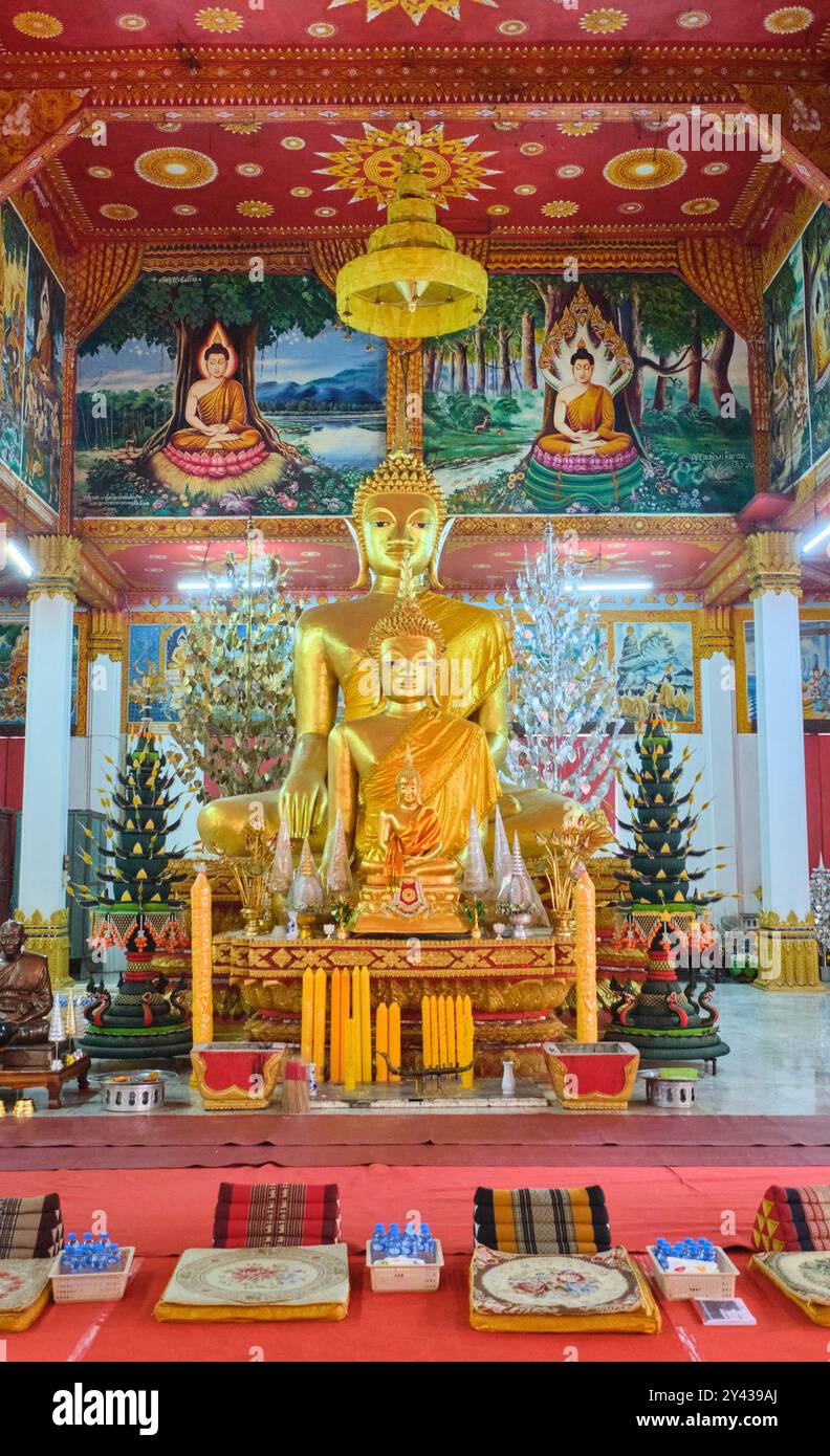 A rich, fancy, gold Buddha statue at the altar of Wat Haysoke in ...