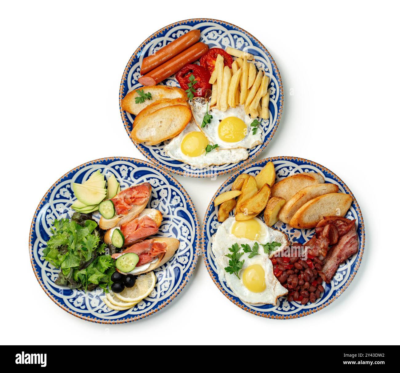 Traditional breakfast plates featuring eggs, sausages, and various ...