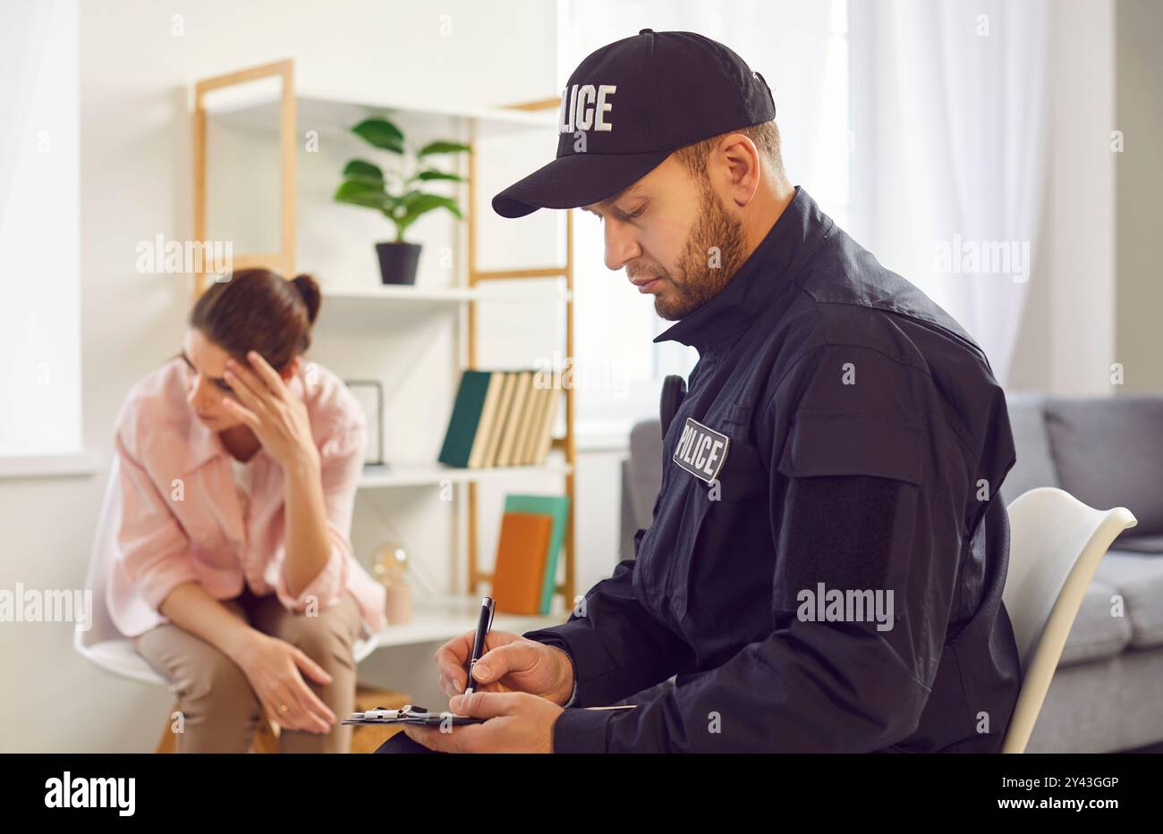 Police Officer Or Detective Investigating Crime, Interviewing Victim Of ...