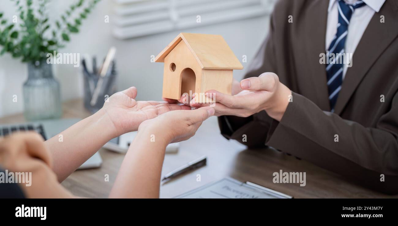 Real Estate Agent Guiding Client Through Home Transfer Process for ...