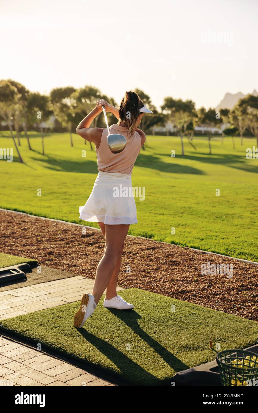 Female golfer driving range hi-res stock photography and images - Alamy