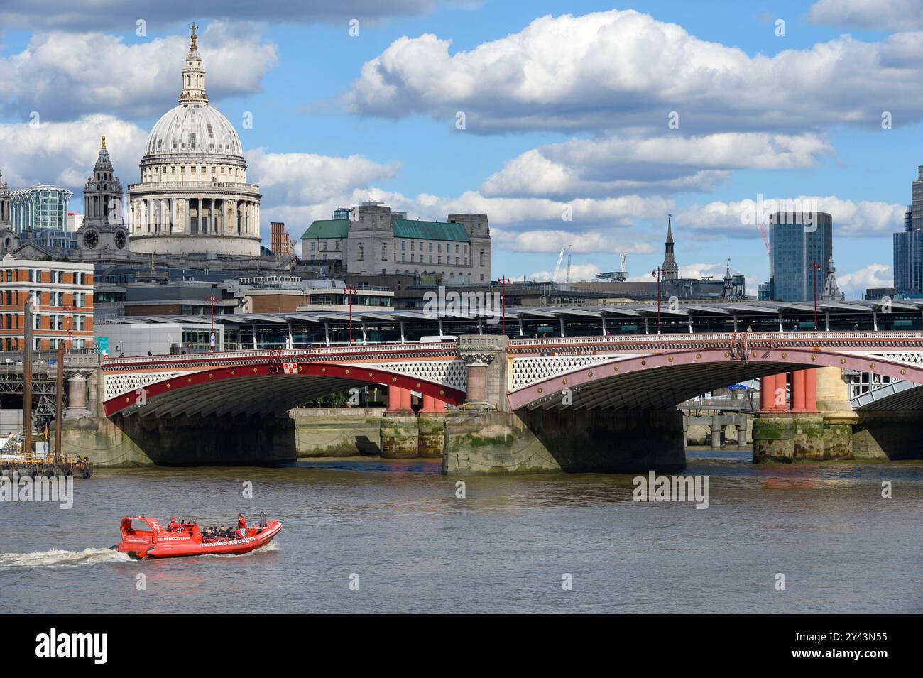London, UK. Thames Rockets RIB speedboat on the River Thames passing ...