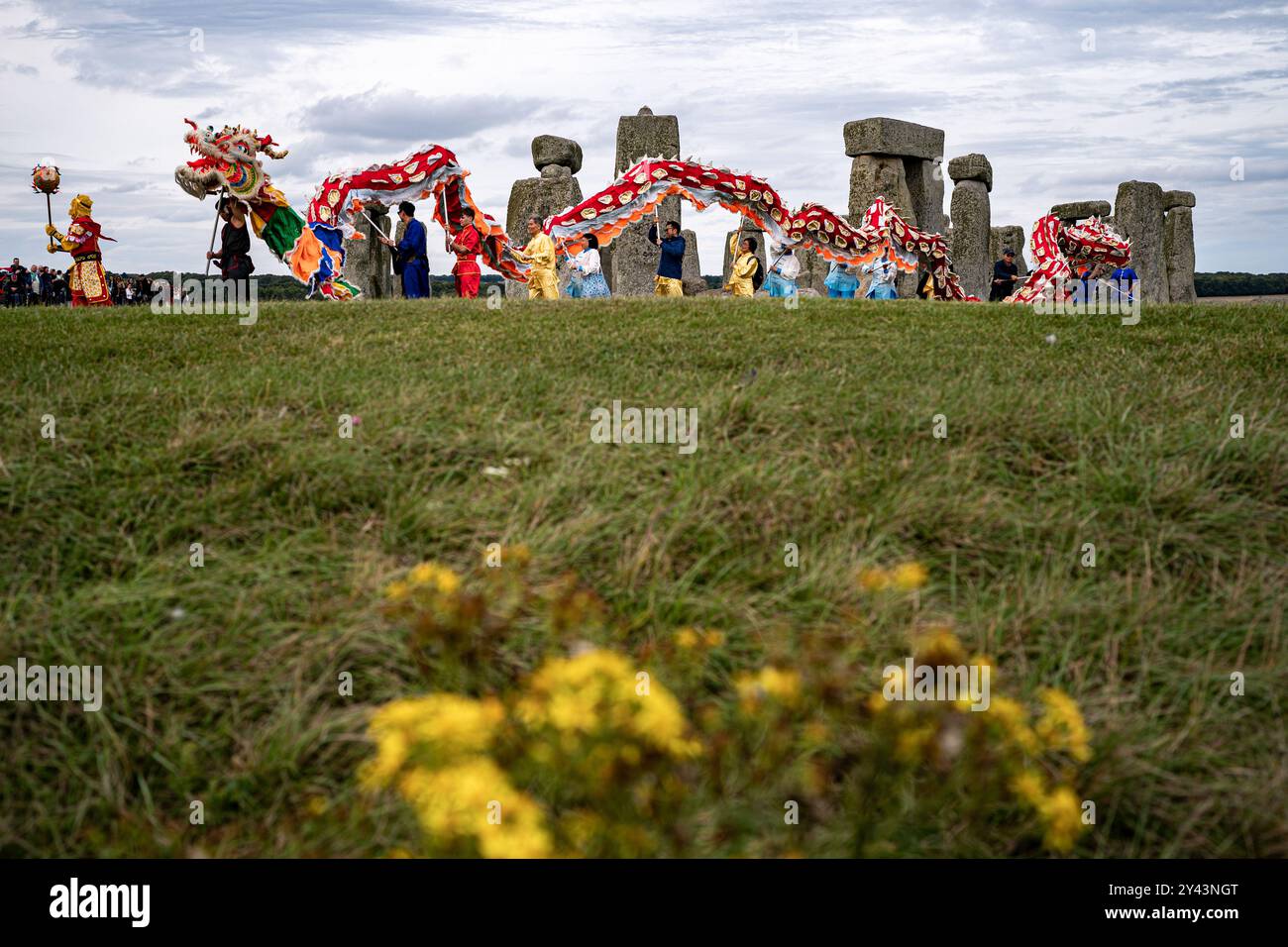 A dragon dance takes place at Stonehenge, Wiltshire, where people ...