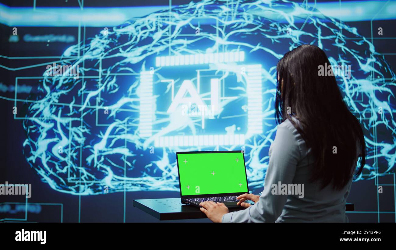 IT specialist using green screen laptop and AI technology for business ...