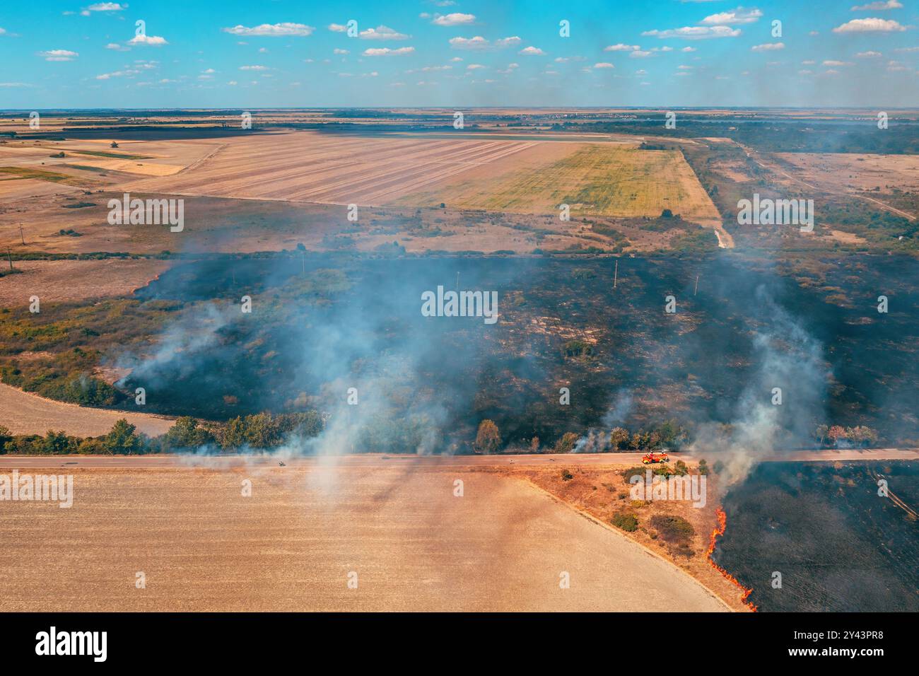 High angle view drone shot of grass burning in countryside landscape ...