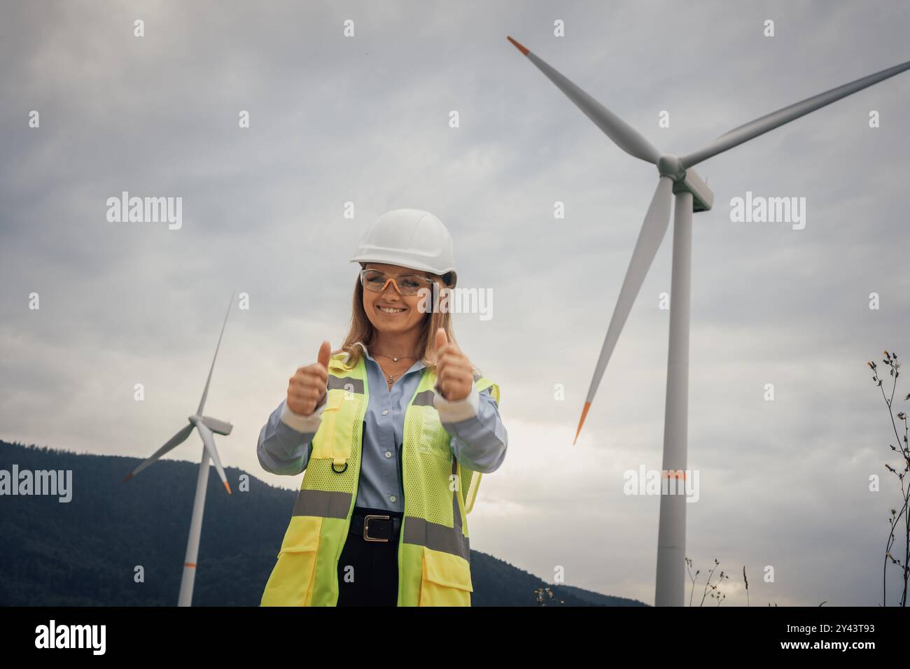 A dedicated Female Engineer at the Wind Farm celebrates advancements in ...
