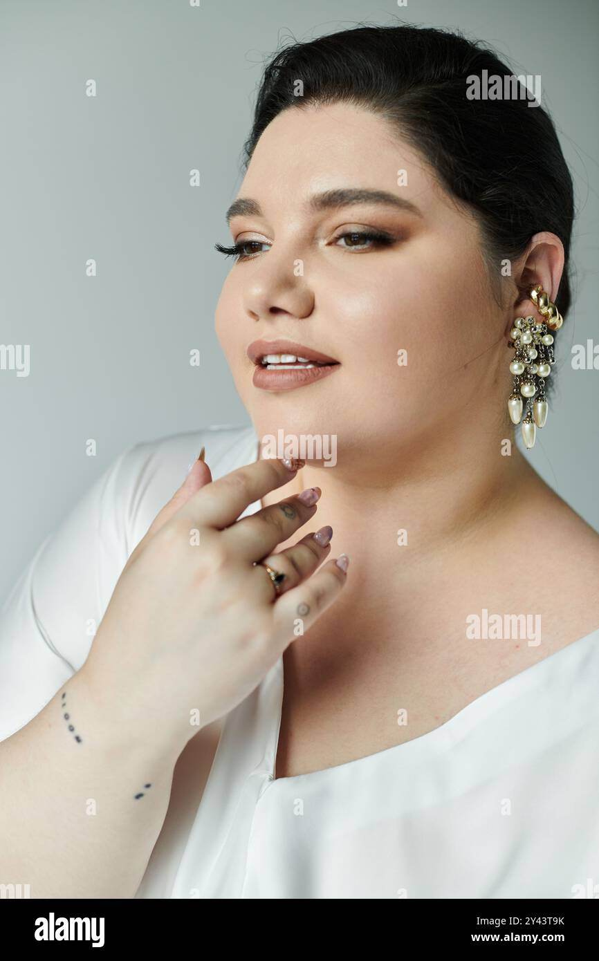 A radiant plus size bride poses gracefully, showcasing her stunning ...