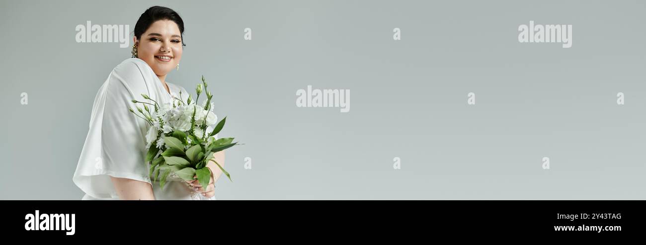 Radiant bride showcases elegance in a white dress with a bouquet ...