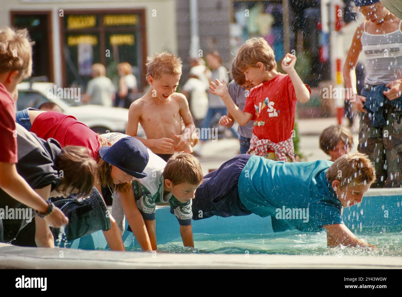 Children playing at fountain at Rynek (Market Square) in Wadowice (Pope ...