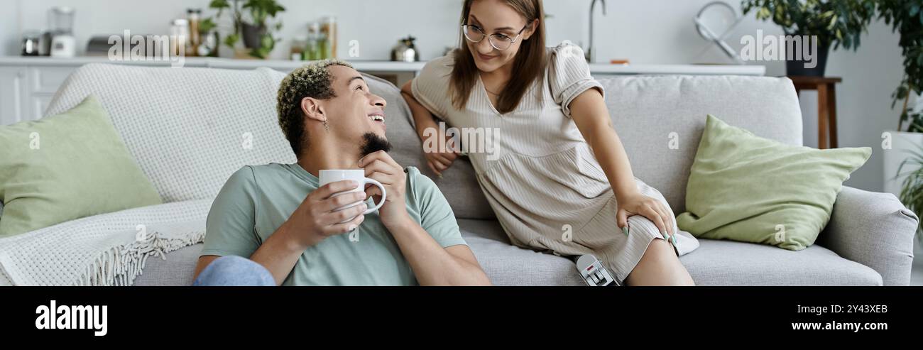 A joyful moment shared between friends over coffee and laughter Stock ...