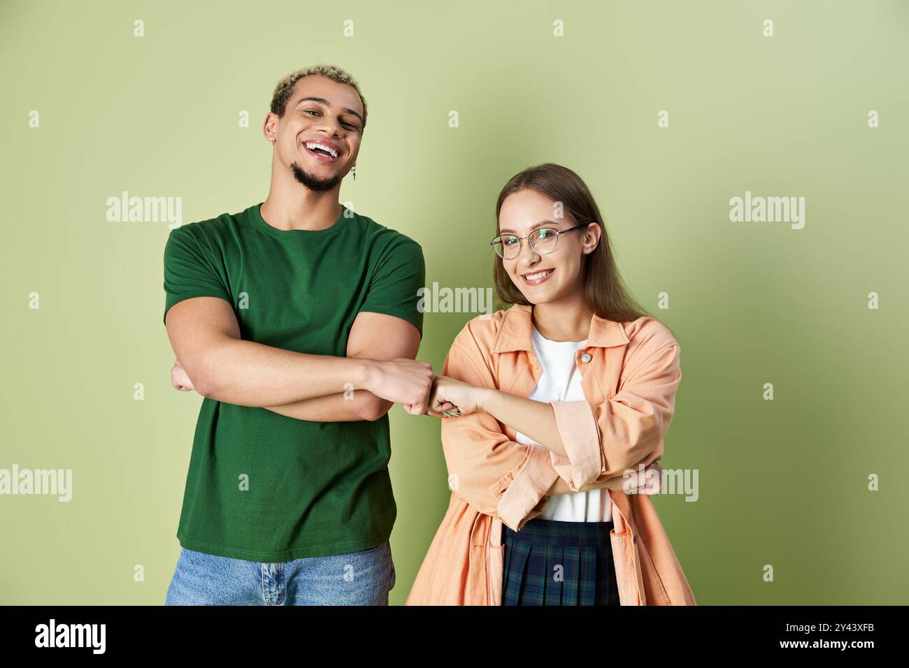 A non binary individual and a friend share a cheerful connection while ...