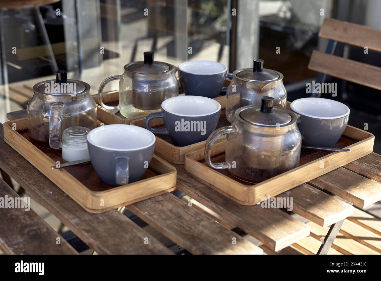 Tea serving trays with glass teapots and cups. Individual sets for 4 ...