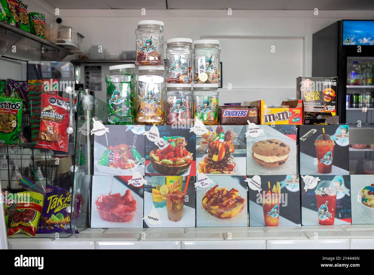 Snacks and treats on counter display Stock Photo - Alamy