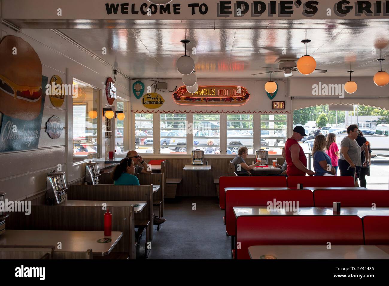 Interior seating and people waiting at a roadside diner Stock Photo - Alamy