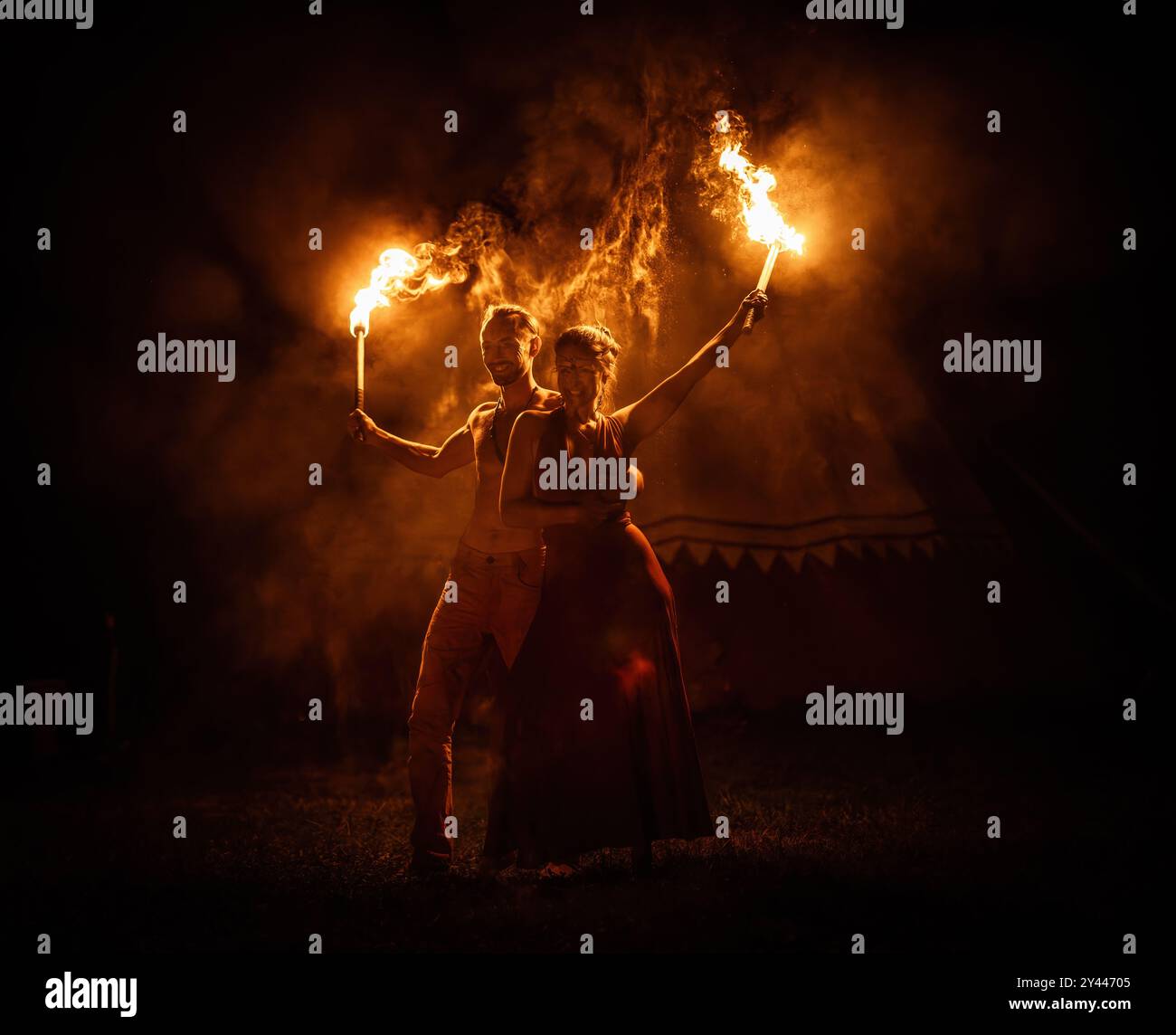 The enchanting fire dancers beautifully showcase their talent with fascinating flames during the ...
