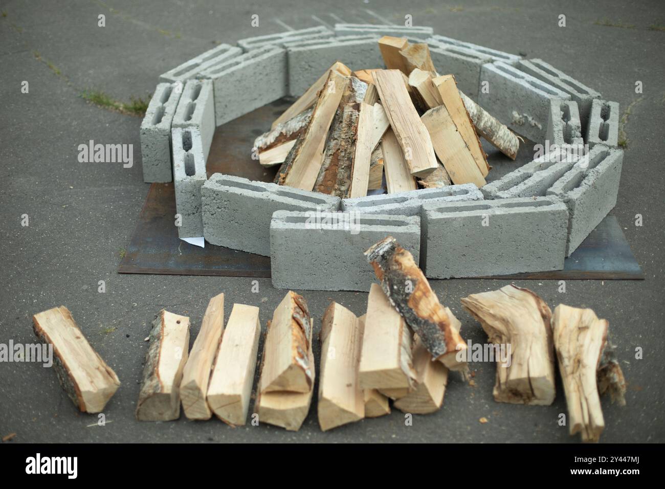 Bonfire on the street. Wood for kindling. Concrete blocks Stock Photo ...