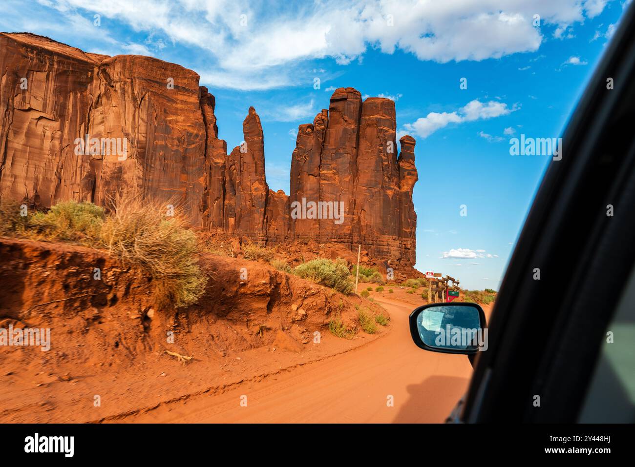 View from car of the "Hand of God" rock formation in Monument Valley ...