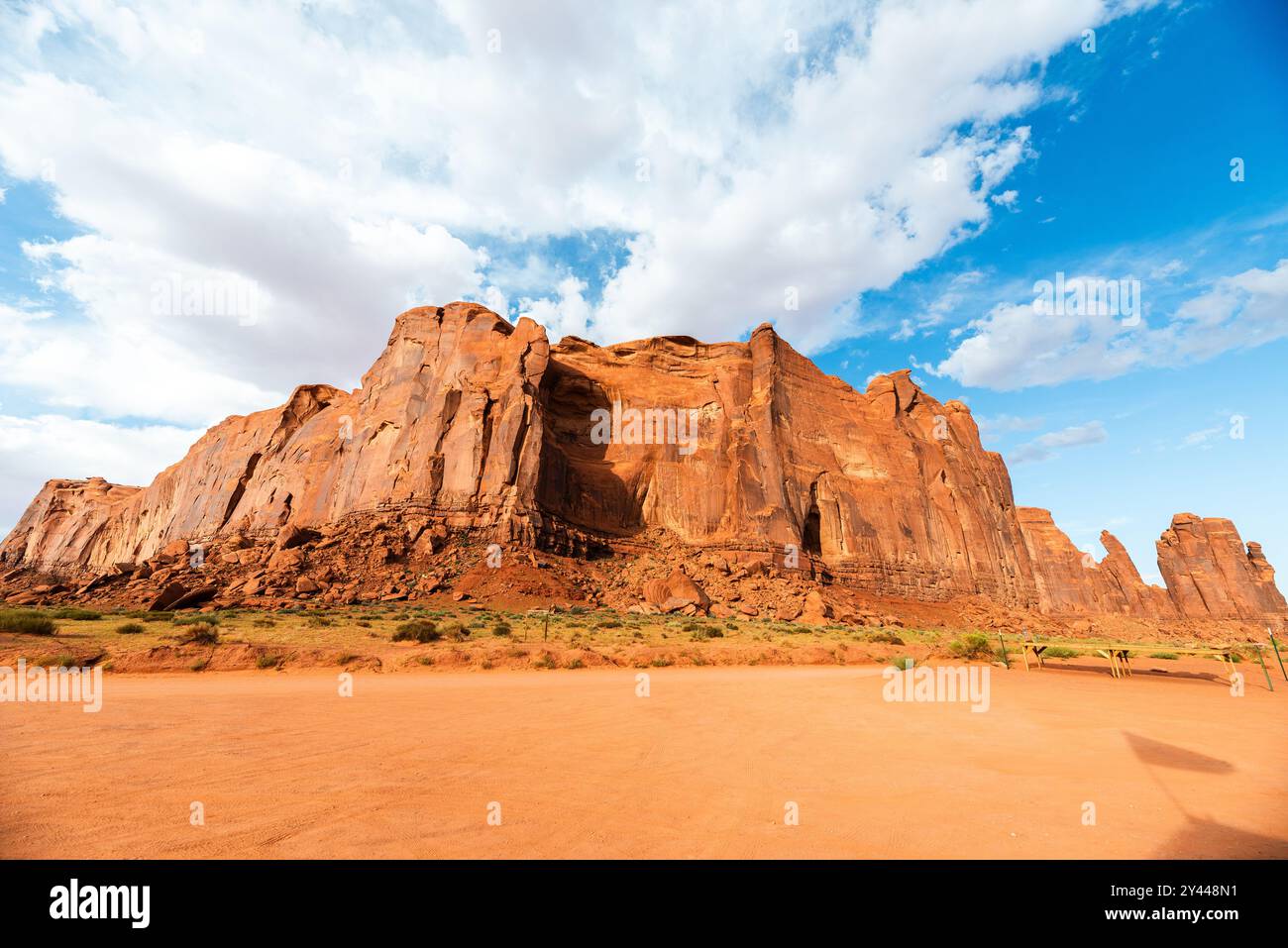 Rain God Mesa's towering cliffs illuminated in Monument Valley Stock ...