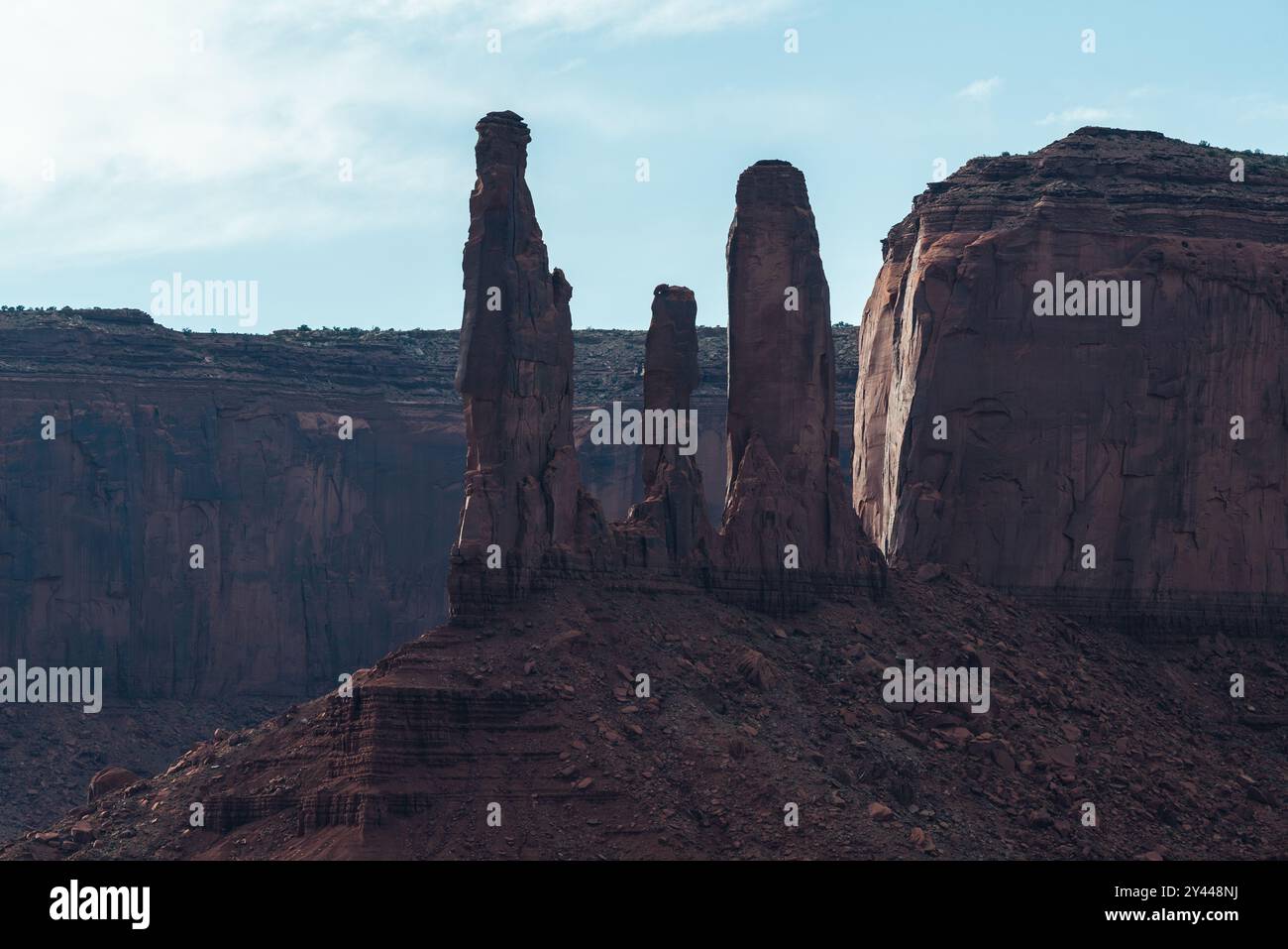 The towering rock formations of the Three Sisters in Monument Valley ...