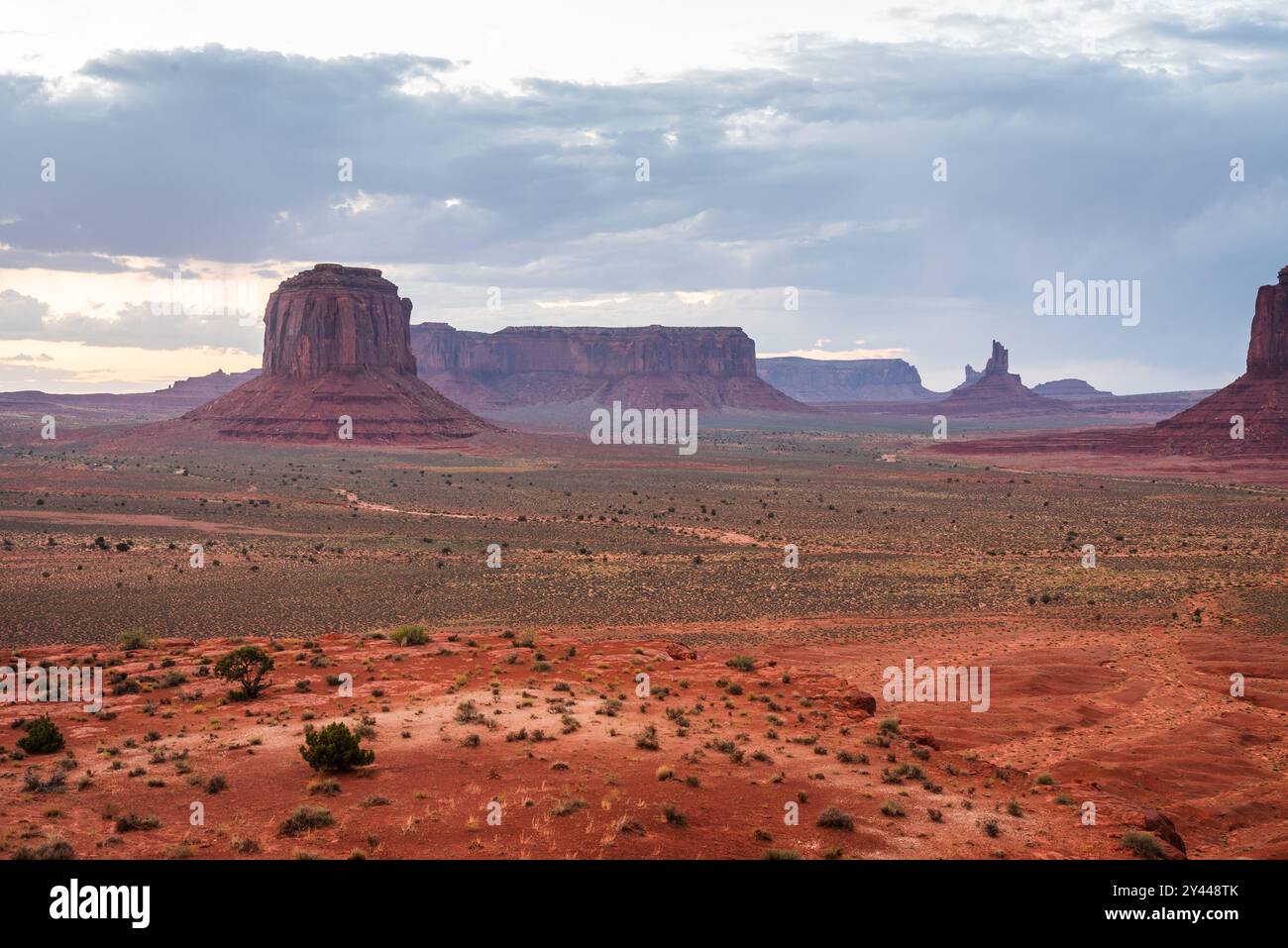 Massive red buttes tower over Monument Valleyâ€™s expansive desert ...