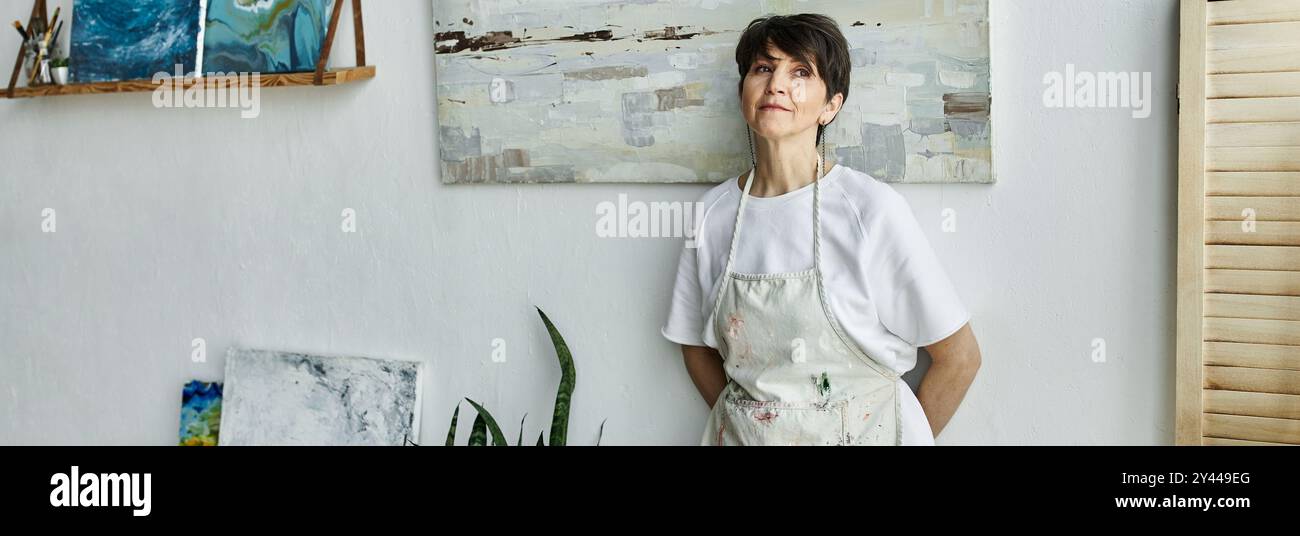 A dedicated artist enjoys her time working on new creations Stock Photo ...
