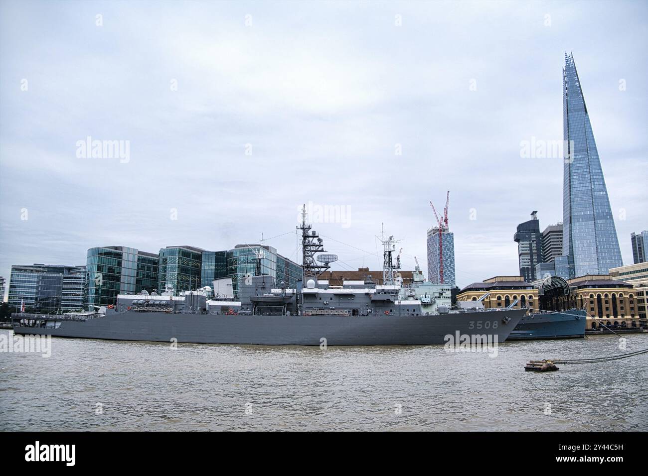 Japanese warship JS Kashima moored alongside HMS Belfast on the River ...