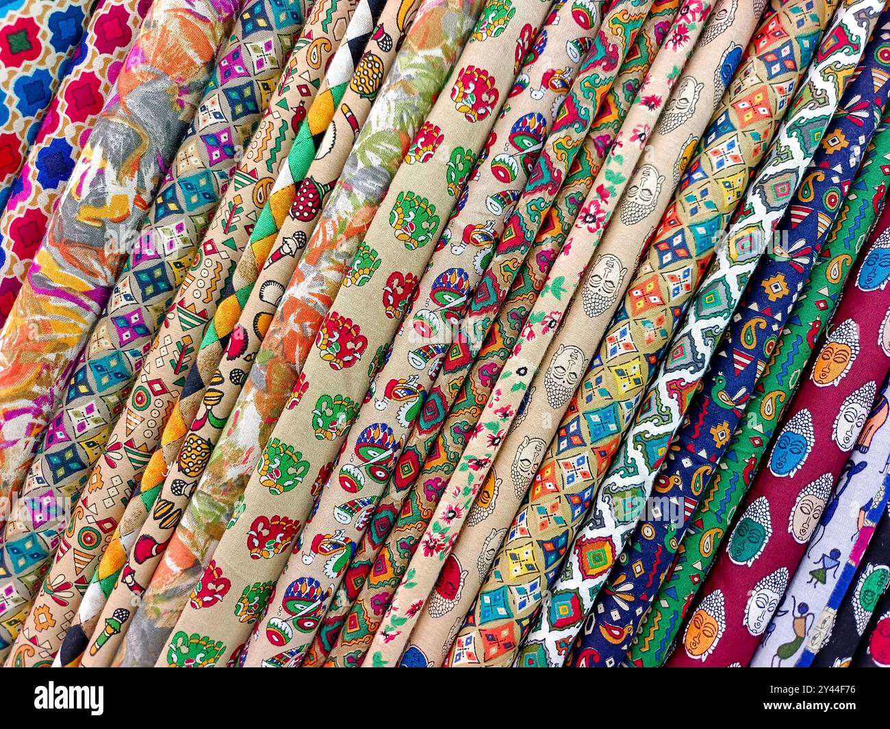 Pallet of vivid and colorful Indian fabric, Closeup view of stacked ...