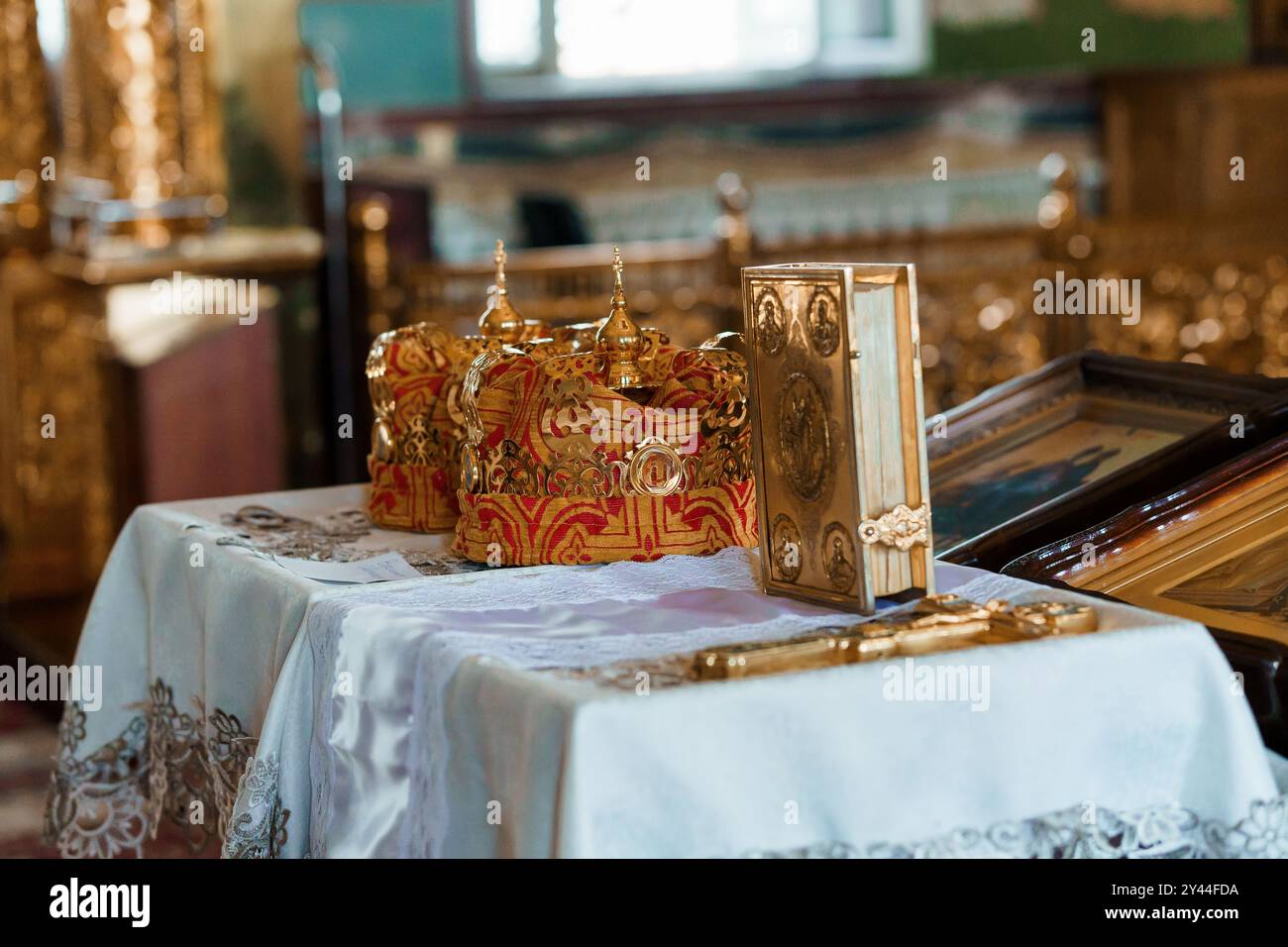Ornate Golden Crowns and Religious Artifacts on Embroidered Altar Table ...